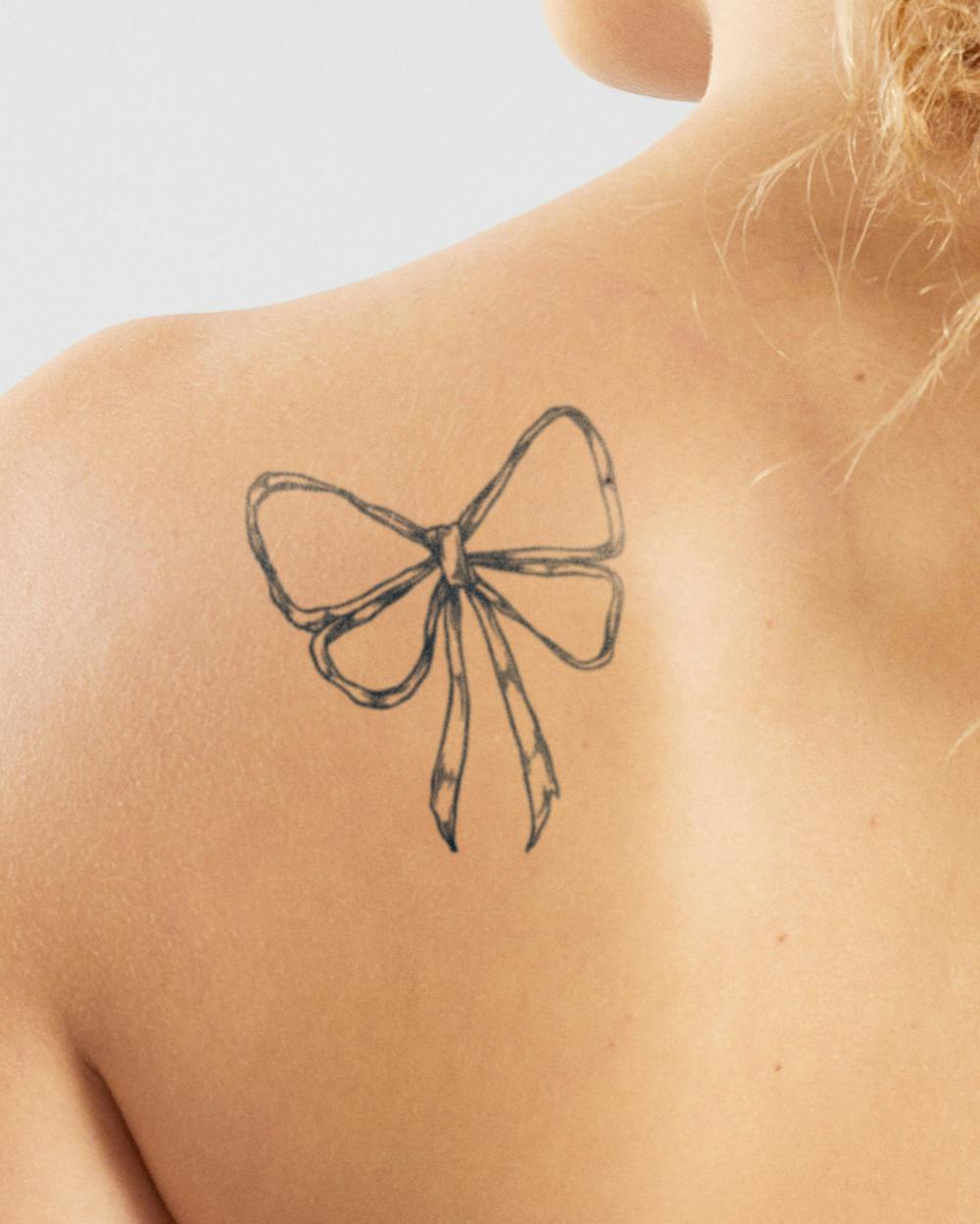 Ribbon Bow Tattoo On Finger